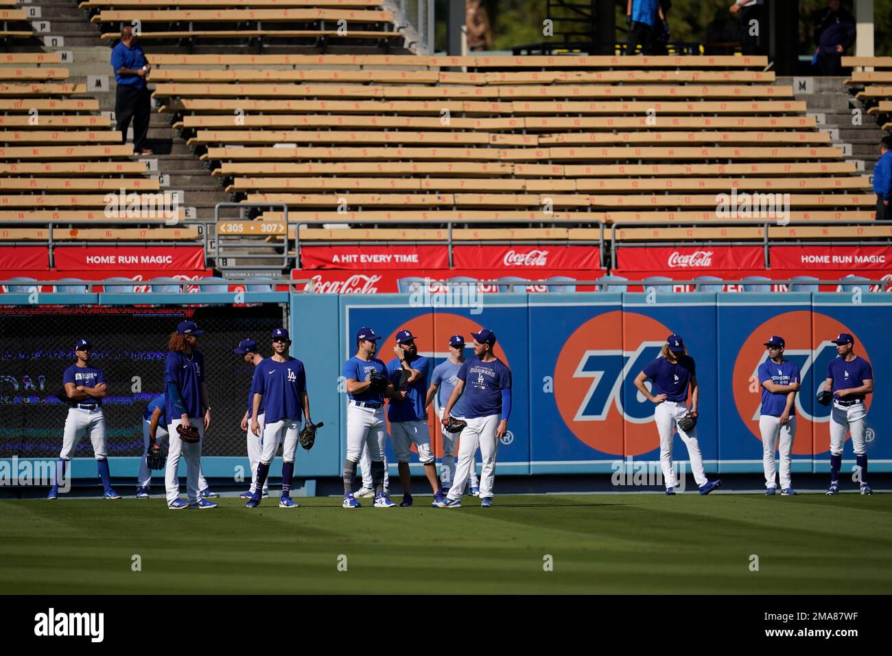 Los Angeles Dodgers players stand in the outfield during batting ...
