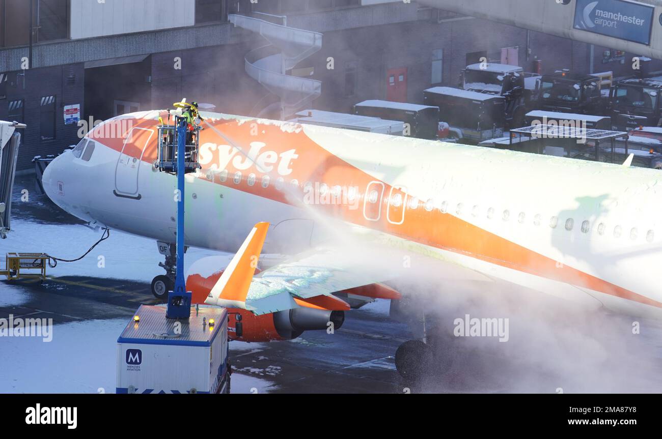 A plane is de-iced at Manchester Airport. People across many parts of ...