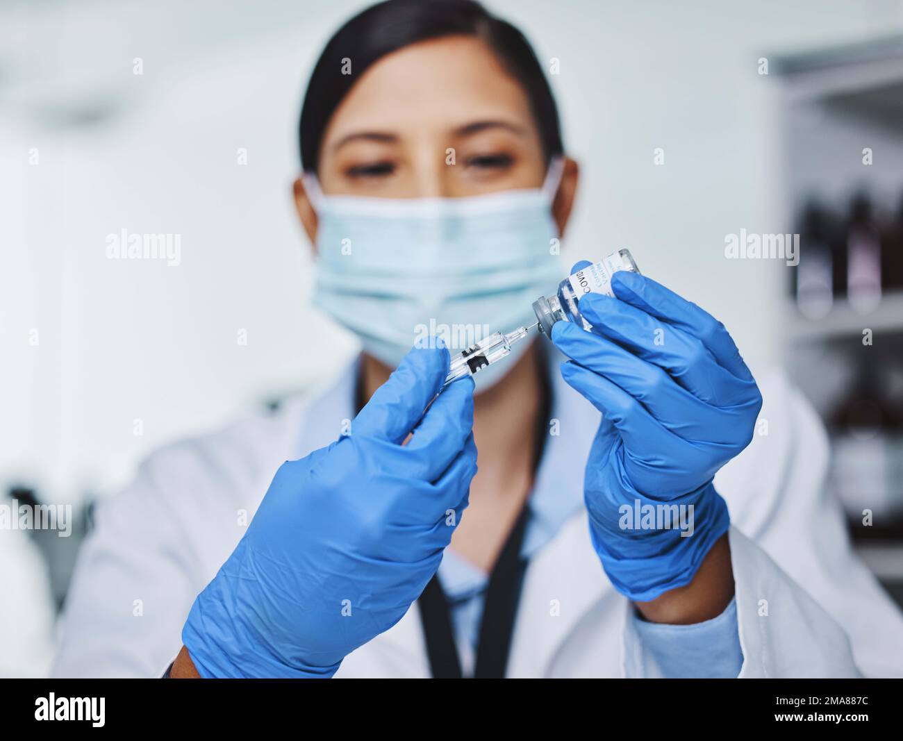 Hours of hard work in a tiny tube. a young female researcher working in ...
