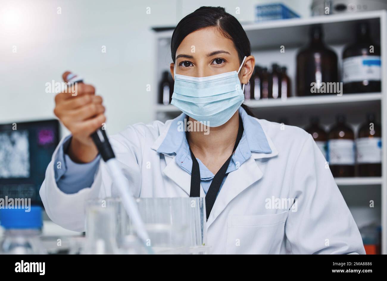 Testing my hypothesis. a young female researcher working in a ...