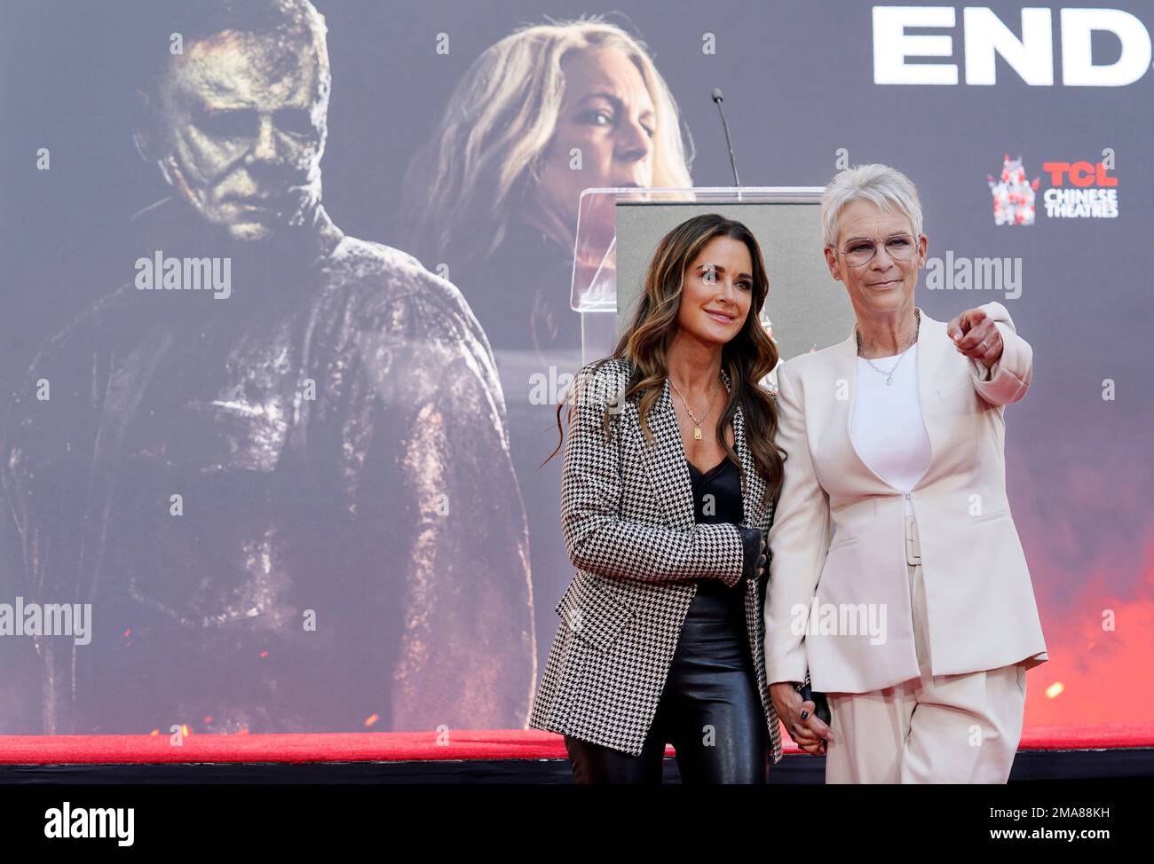 "Halloween Ends" star Jamie Lee Curtis, right, poses with fellow cast ...