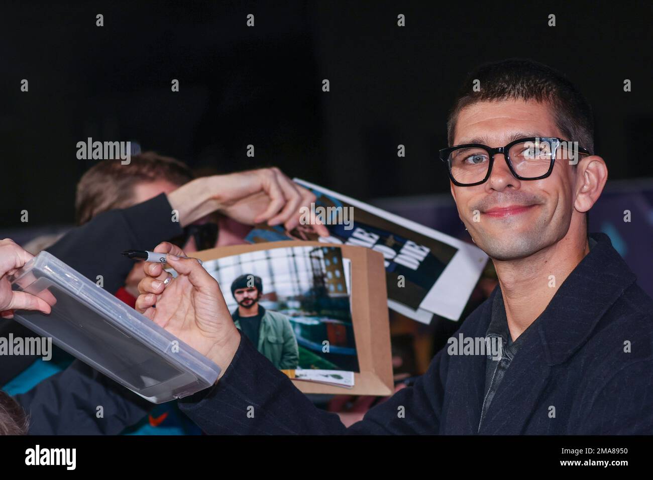 Ben Whishaw signs autographs upon arrival for the premiere of the film ...