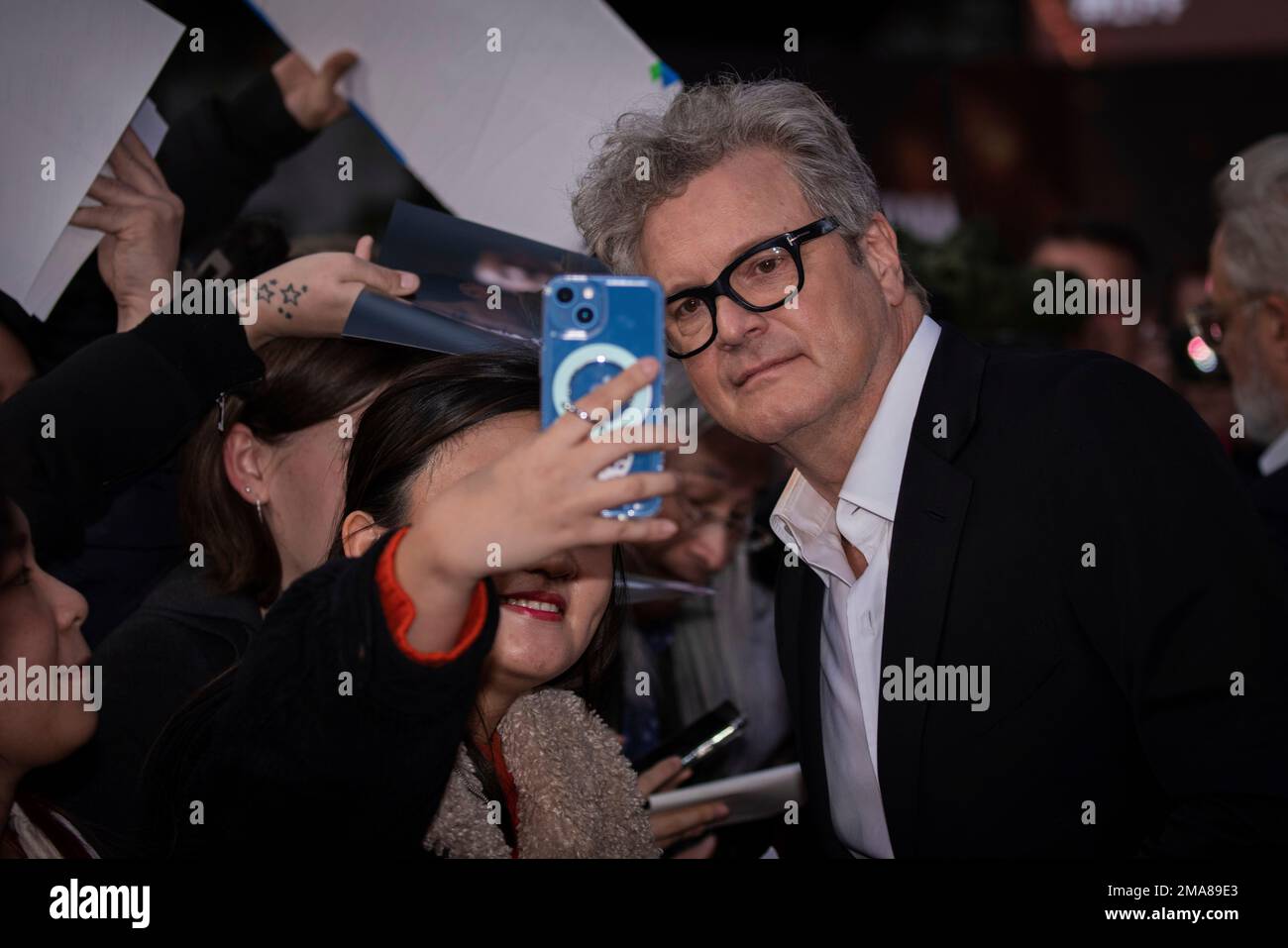 Colin Firth poses for photographs with fans upon arrival for the ...