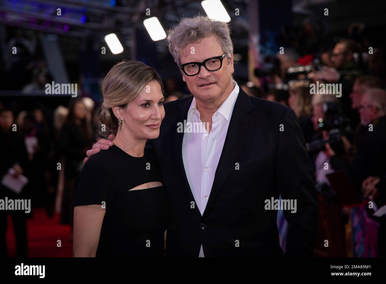Maggie Cohn and Colin Firth pose for photographers upon arrival for the ...