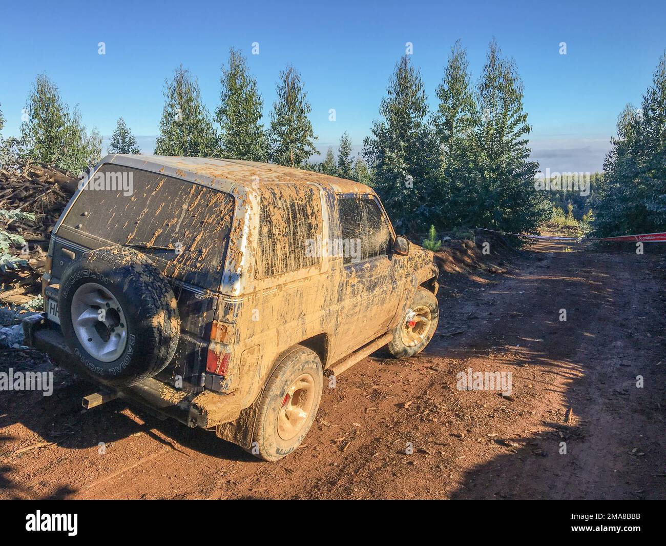 Muddy 4x4 support vehicle on mountain road Stock Photo - Alamy