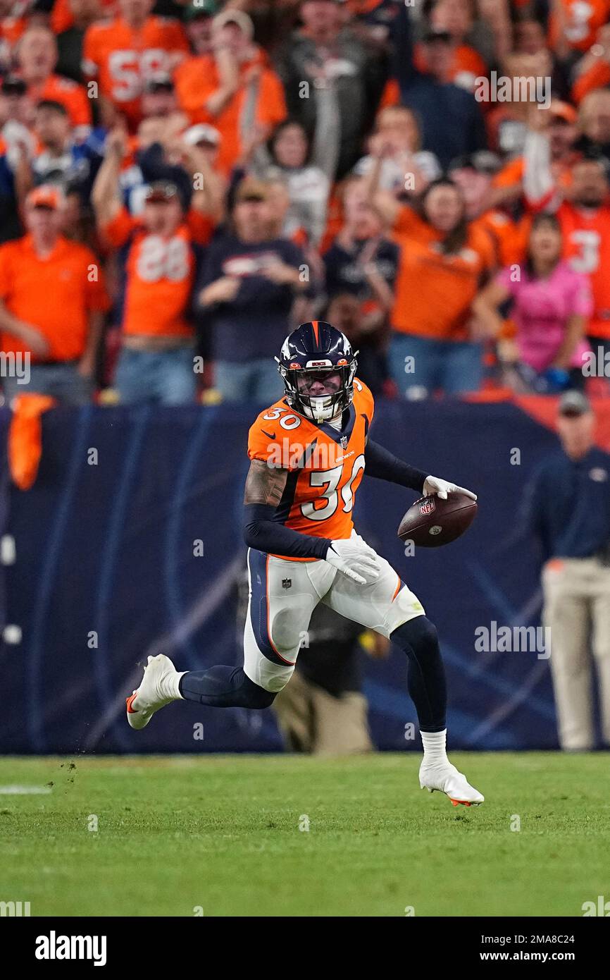 Denver Broncos safety Caden Sterns (30) runs back a pass against the ...
