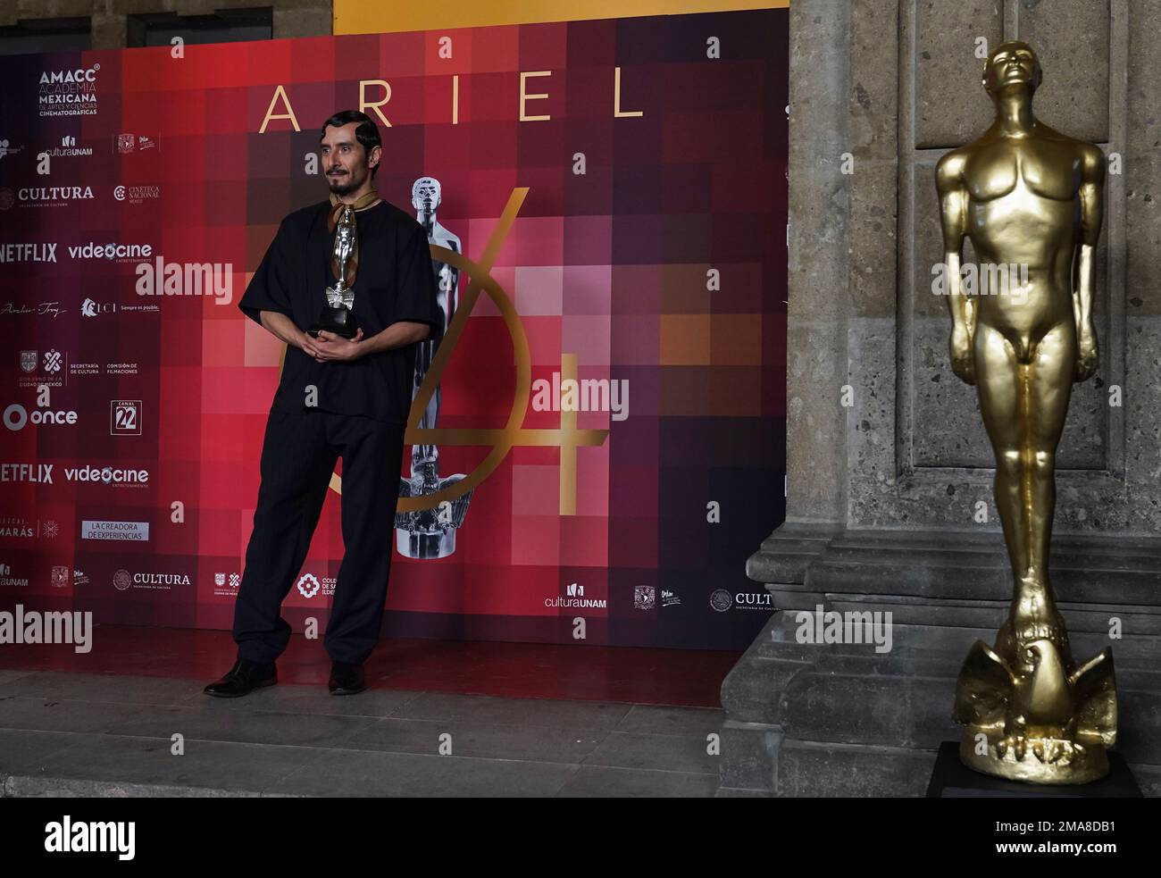 Raul Briones holds his award for best male actor for his role in the ...