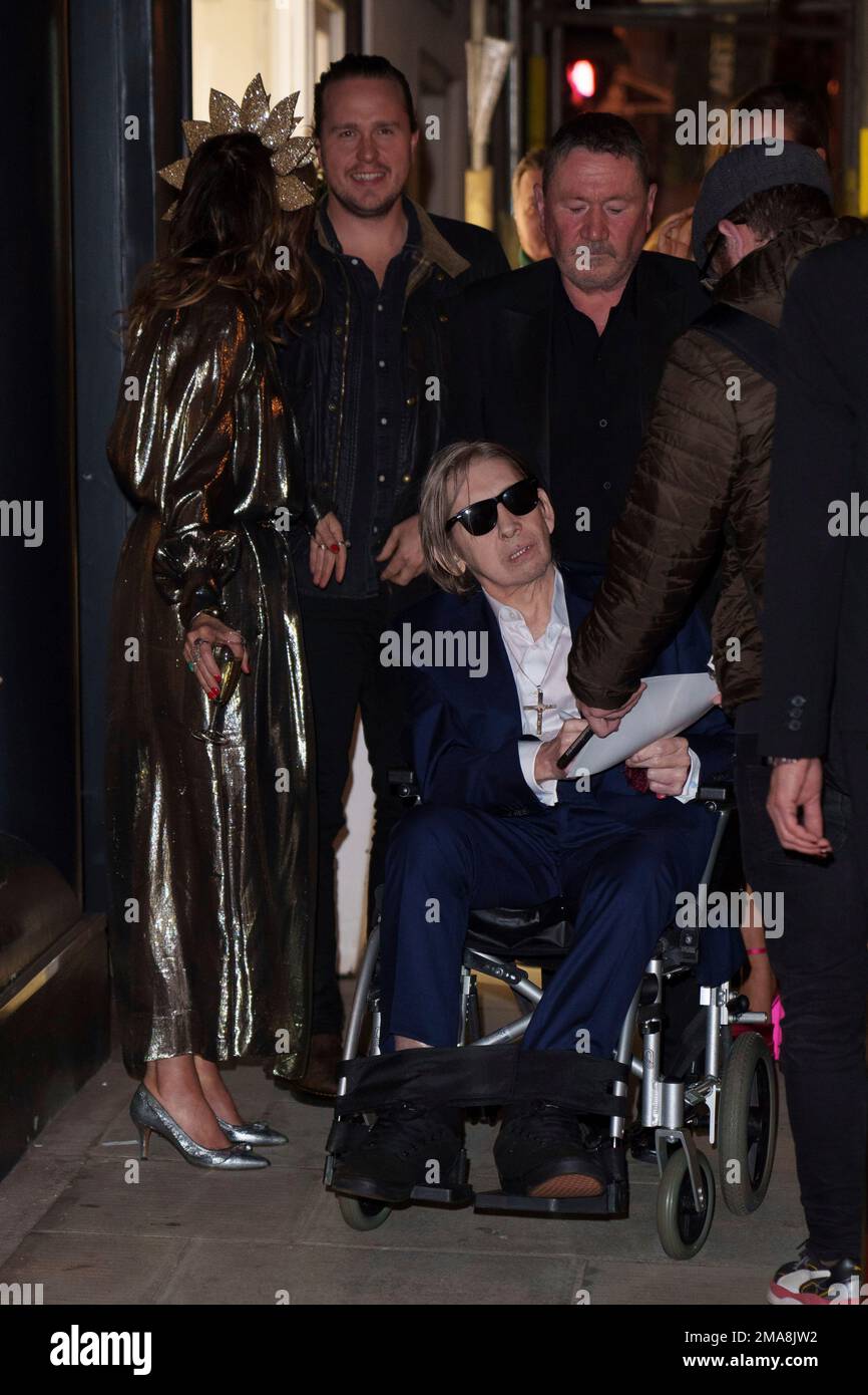 Shane MacGowan signs an autograph upon arrival at the Shane MacGowan ...