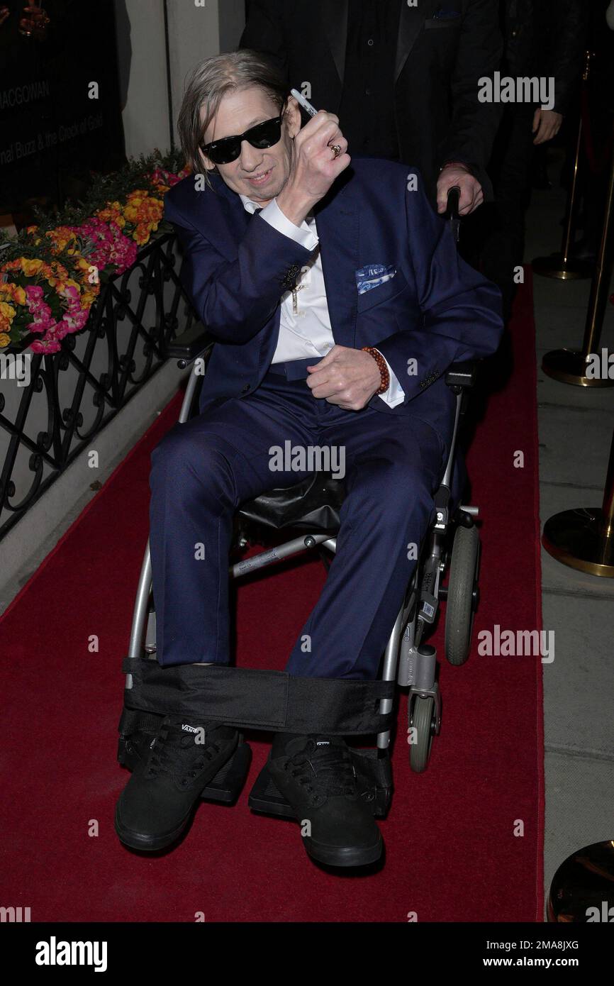 Shane MacGowan poses for photographers upon arrival at the Shane ...