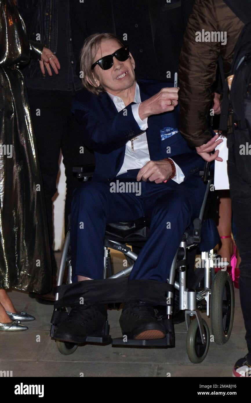 Shane MacGowan signs an autograph upon arrival at the Shane MacGowan ...