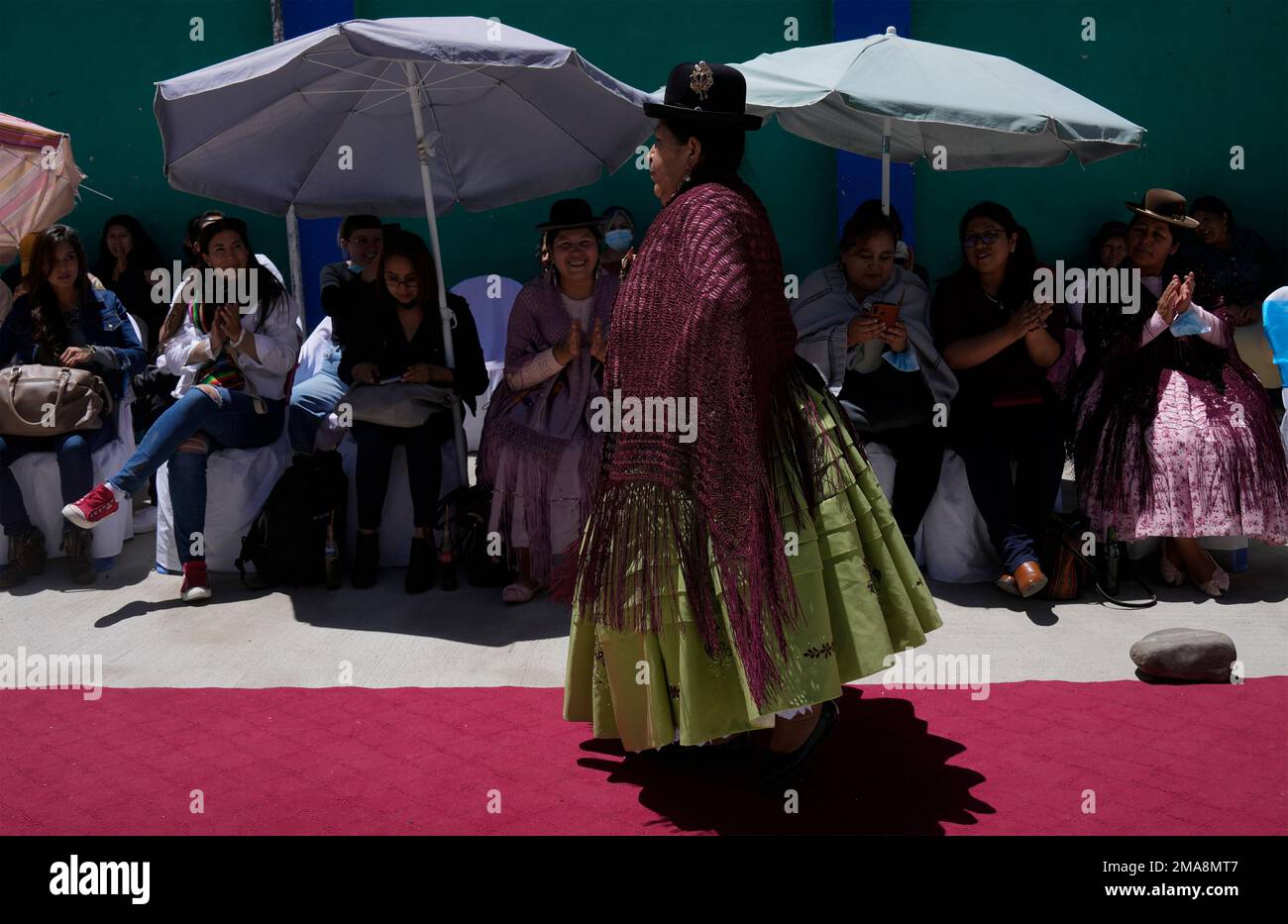 An inmate models her own creation on the catwalk during a fashion show ...