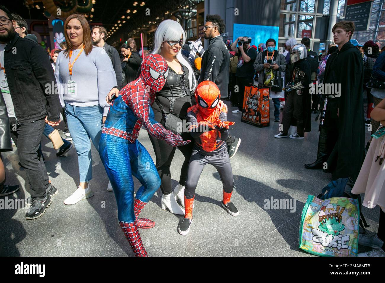 People dressed as Marvel Comics characters Spider-Man and Spider-Woman ...
