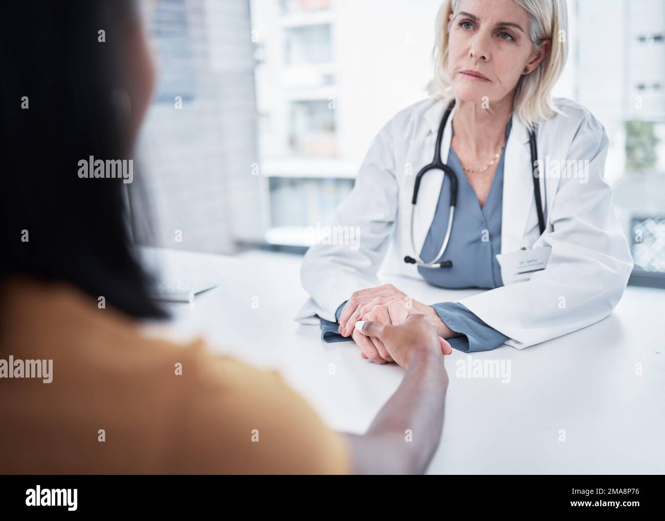 Trust the process of recovery. a doctor holding hands with her patient ...