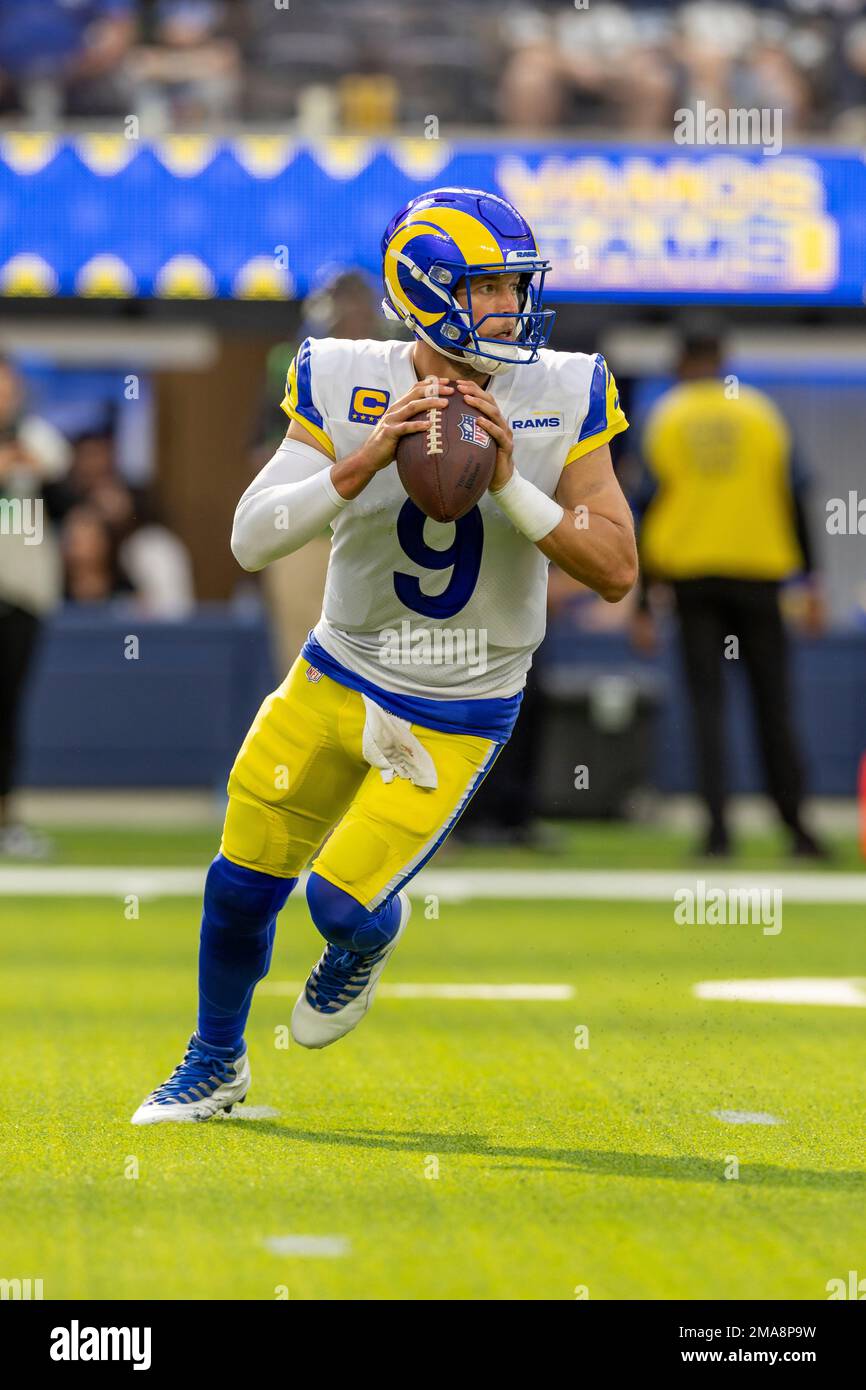 Quarterback (9) Matthew Stafford of the Los Angeles Rams rolls out to ...