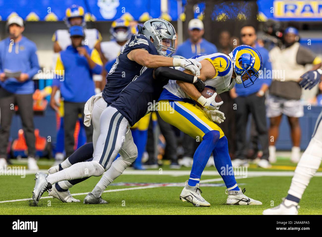 Tight end (89) Tyler Higbee of the Los Angeles Rams is tackled by (55 ...