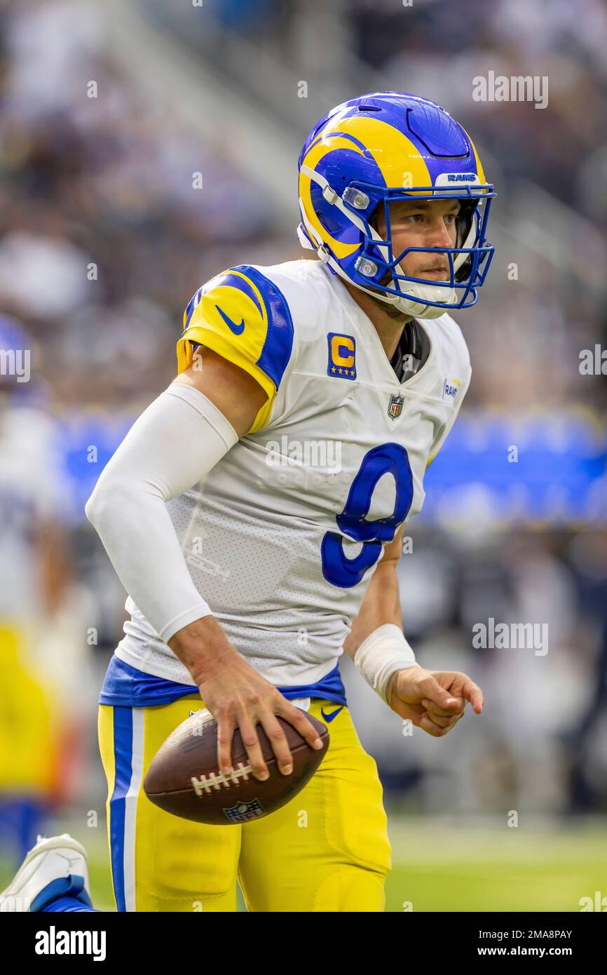 Quarterback (9) Matthew Stafford of the Los Angeles Rams rolls out to ...