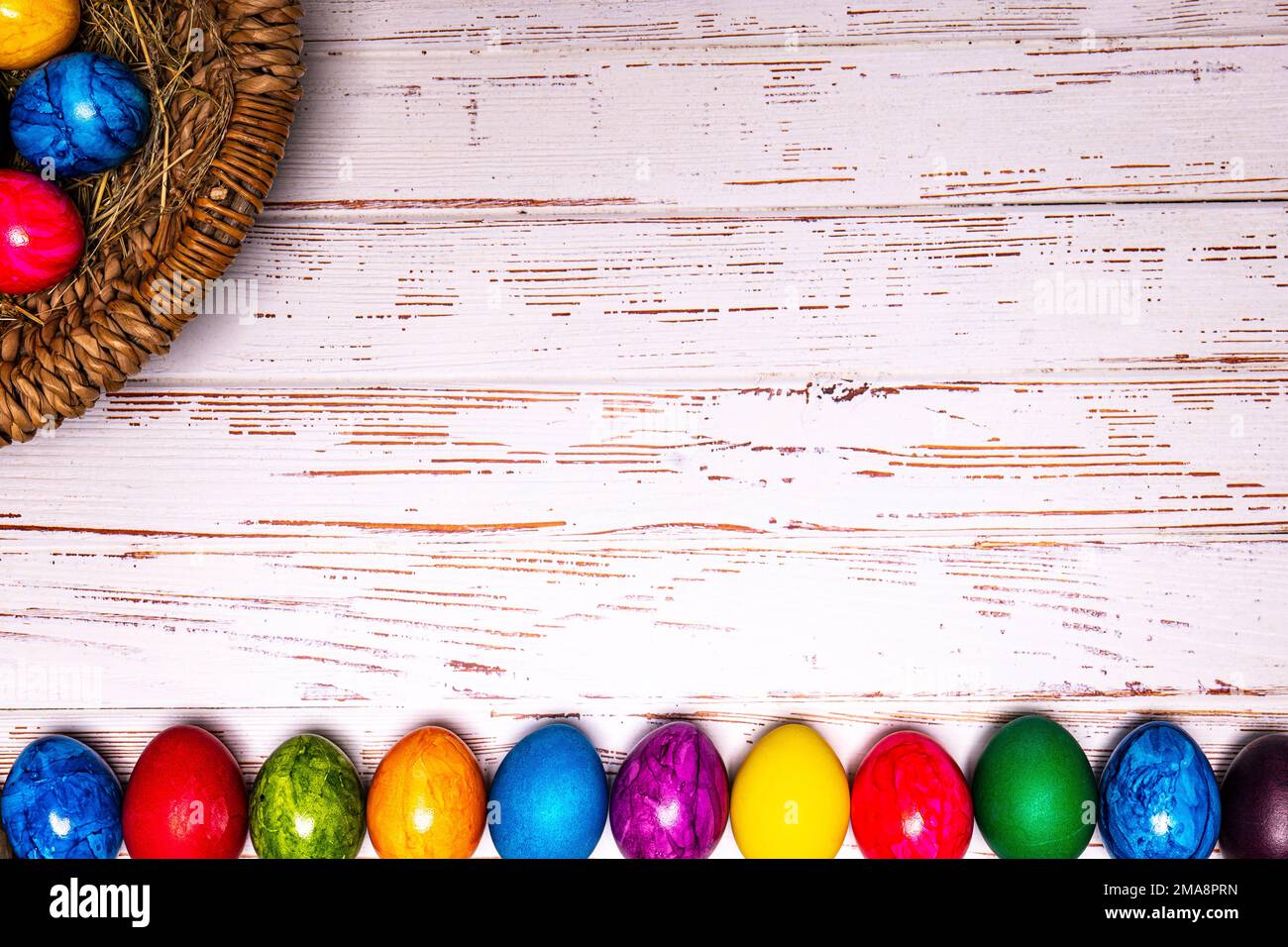 Tabletop easter theme with copy space. Colorful easter eggs with basket ...
