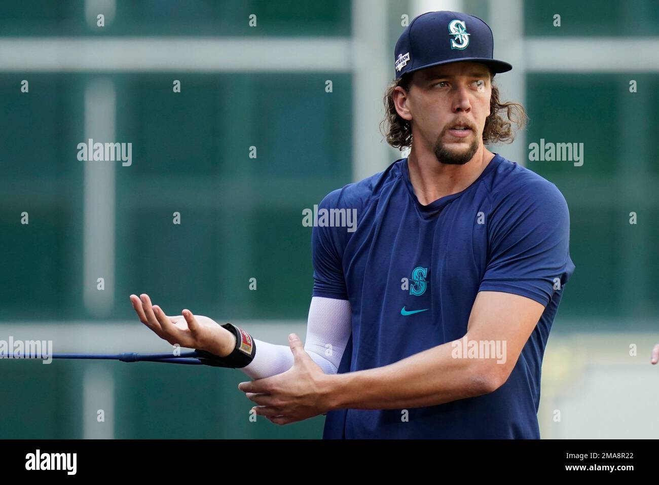 Seattle Mariners pitcher Logan Gilbert stretches during a workout ahead ...