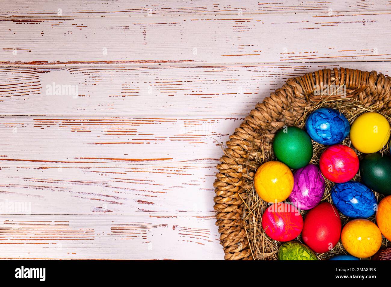 Tabletop easter theme with copy space. Colorful easter eggs with basket ...