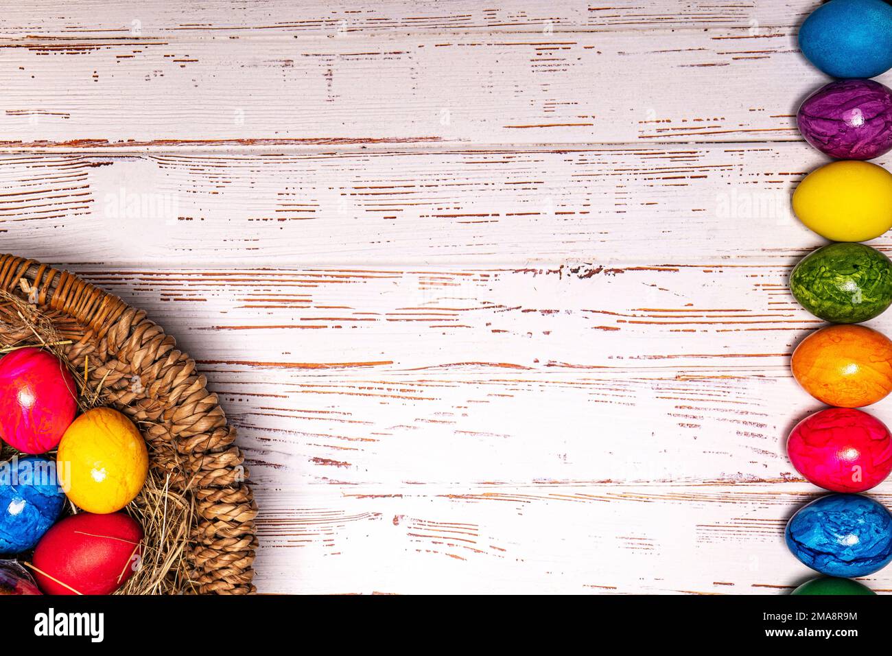 Tabletop easter theme with copy space. Colorful easter eggs with basket ...