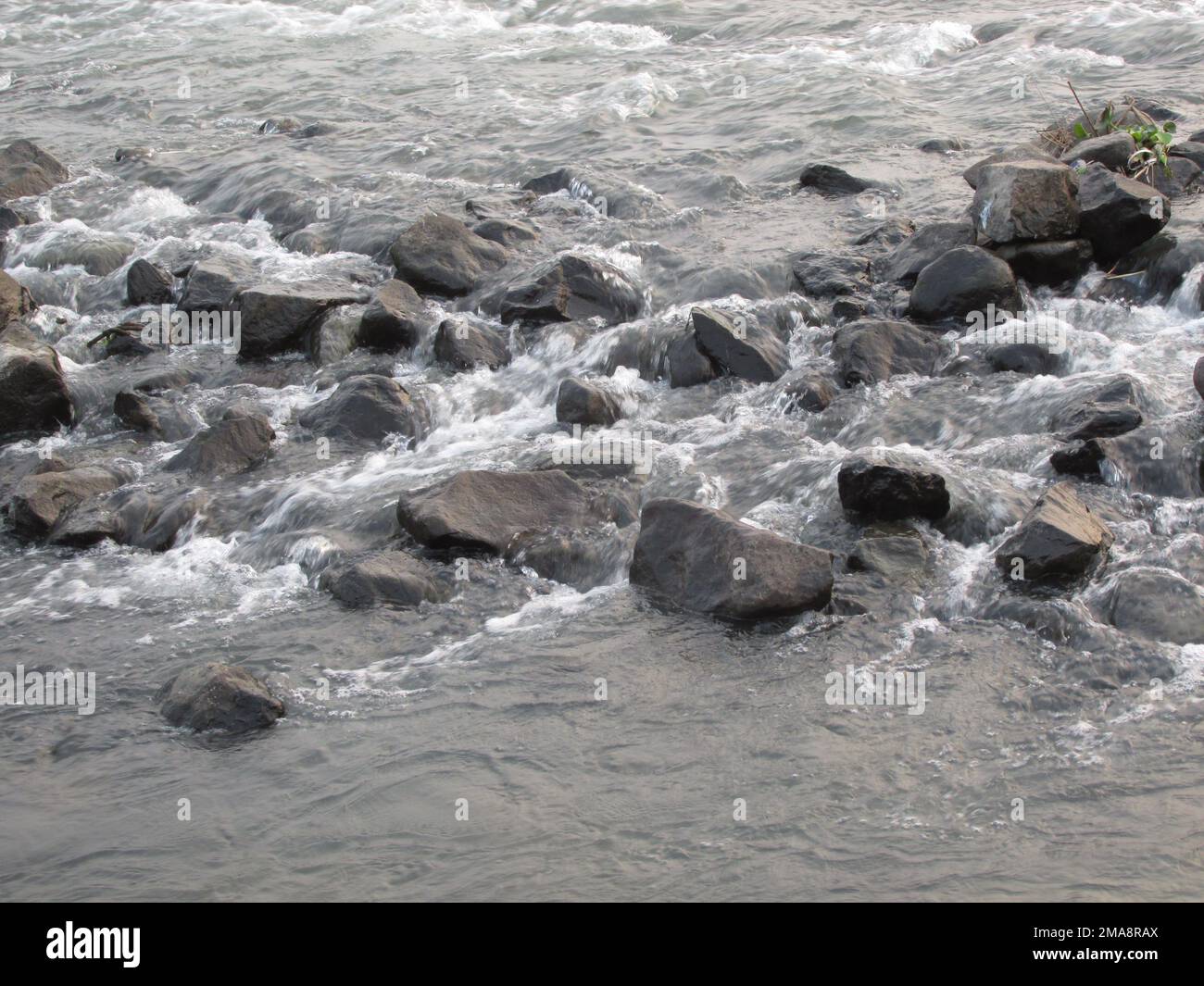 seawater in white wave stone water Stock Photo - Alamy