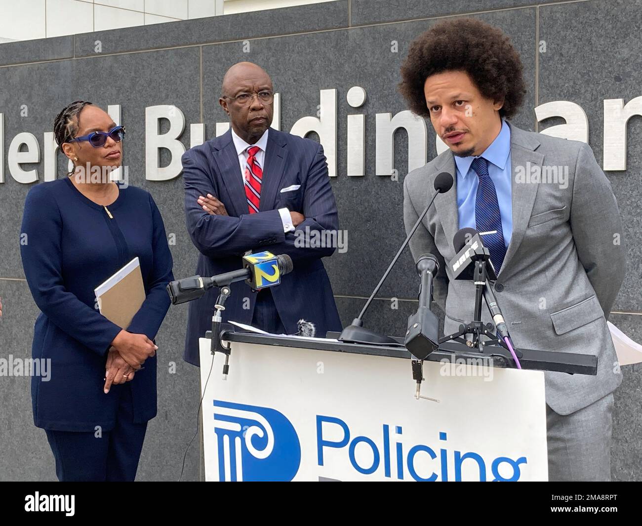 Comedian Eric André, right, speaks at a news conference outside the ...