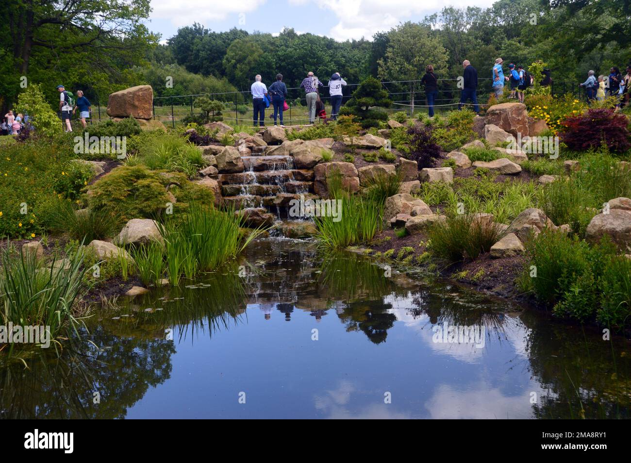 People Standing & Walking by the Waterfall in the Chinese Streamside ...