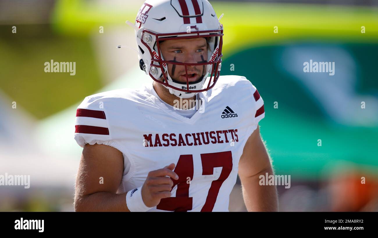 Massachusetts' Ethan Dumont plays during an NCAA football game on ...