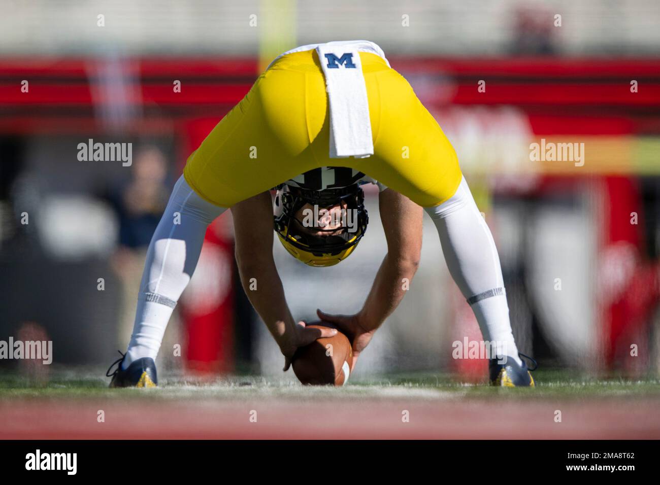 Michigan long snapper Evan Boutorwick (46) warms-up on the field before ...