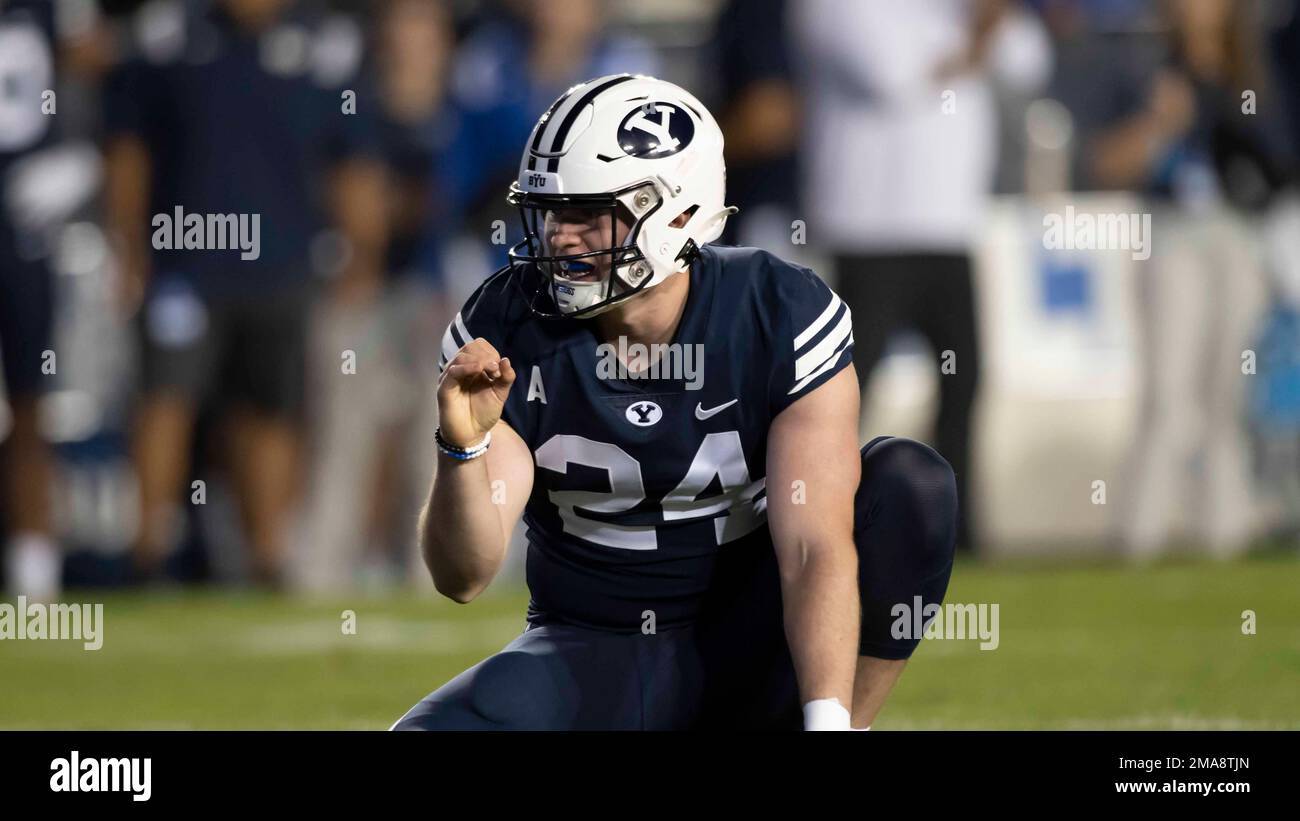 Brigham Young Cougars punter Ryan Rehkow (24) calls for the football ...