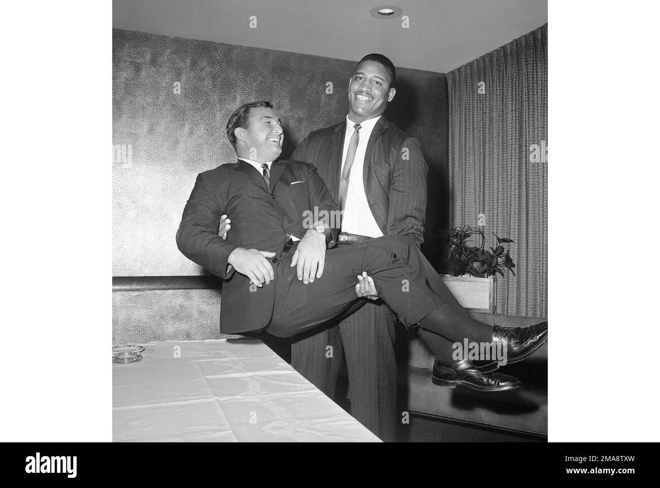 FILE - Junious "Buck" Buchanan lifts Dallas Texans coach Hank Stram as ...