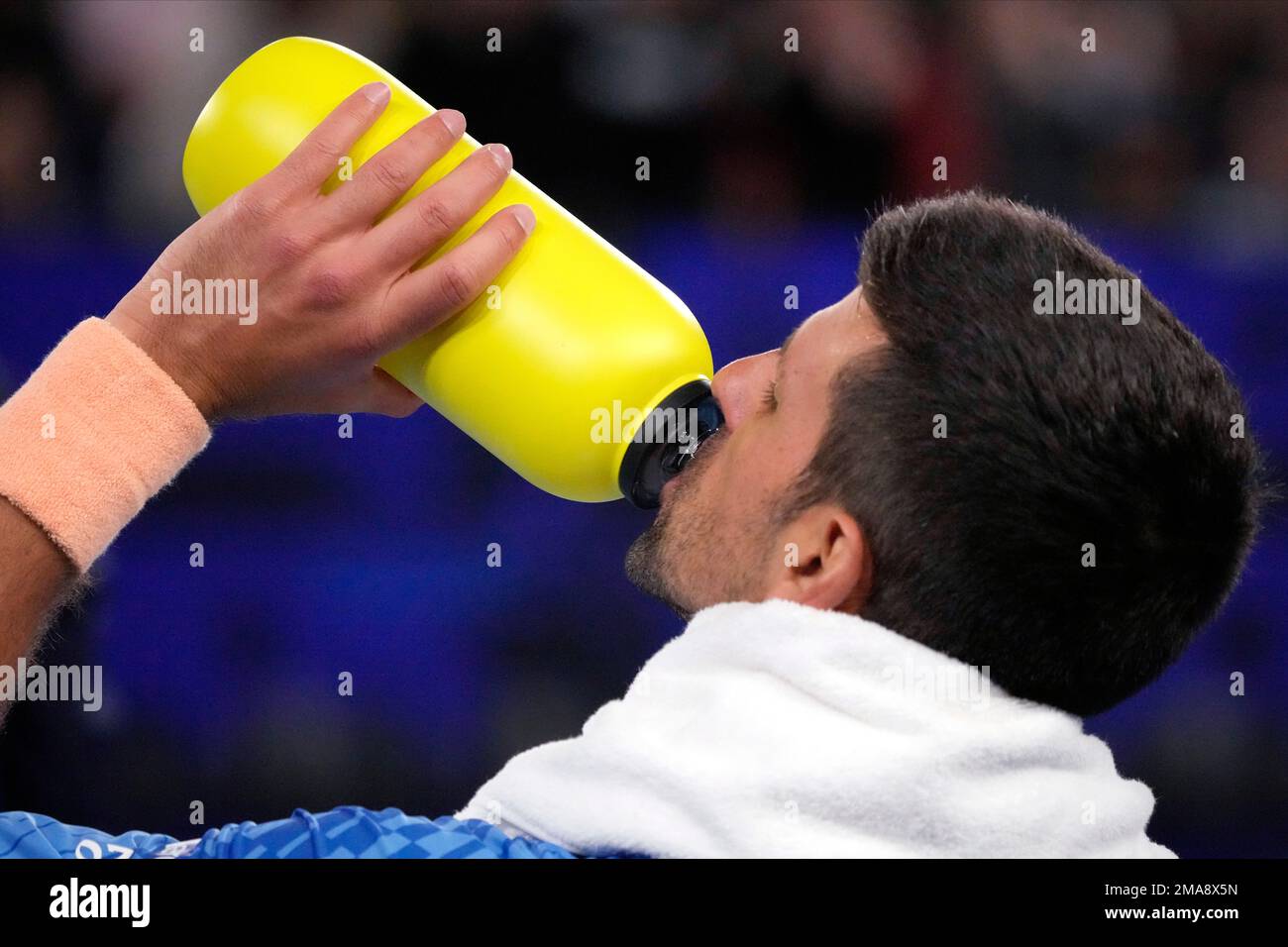 Novak Djokovic of Serbia takes a drink during his second round match ...