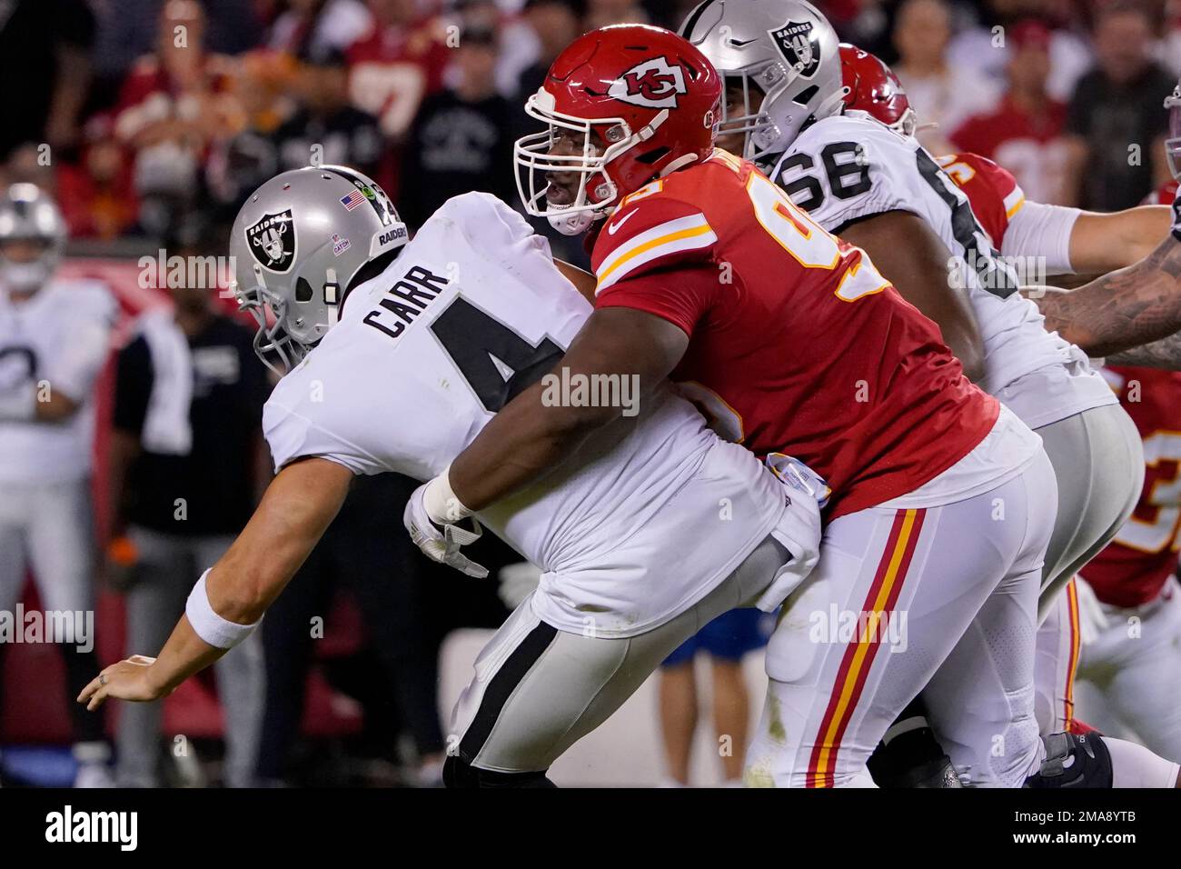 Las Vegas Raiders quarterback Derek Carr (4) is sacked by Kansas City ...