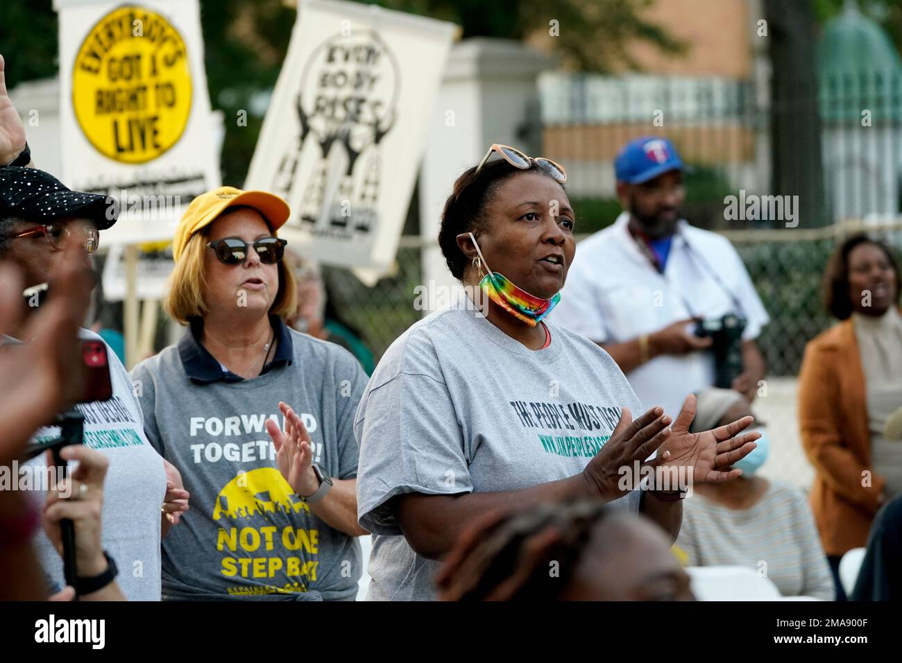Jackson residents Vashti Clayton, right, and Mary Myers chant with ...