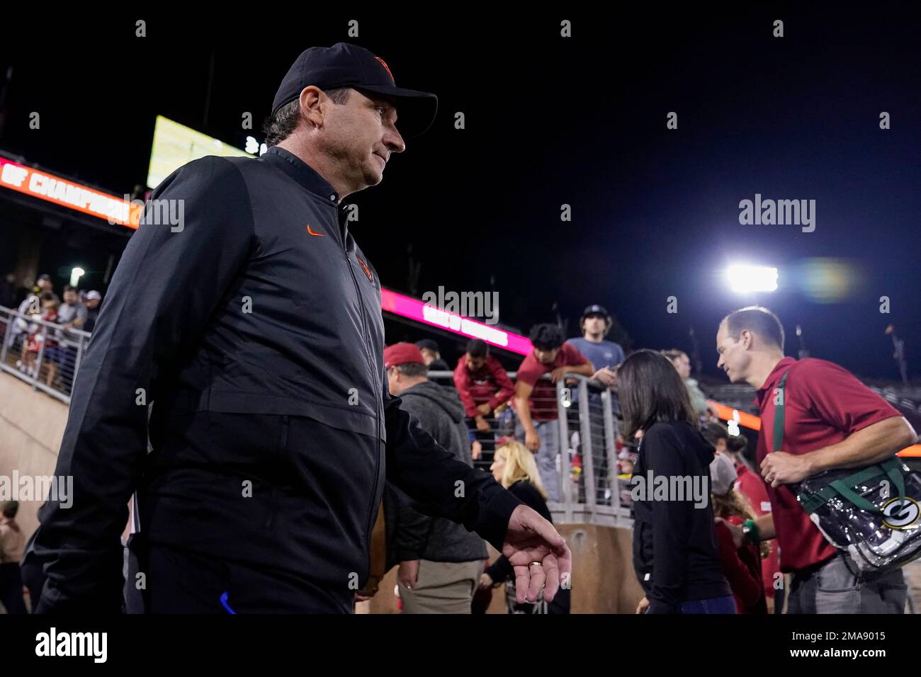 Oregon State head coach Jonathan Smith, left, takes the field for an ...