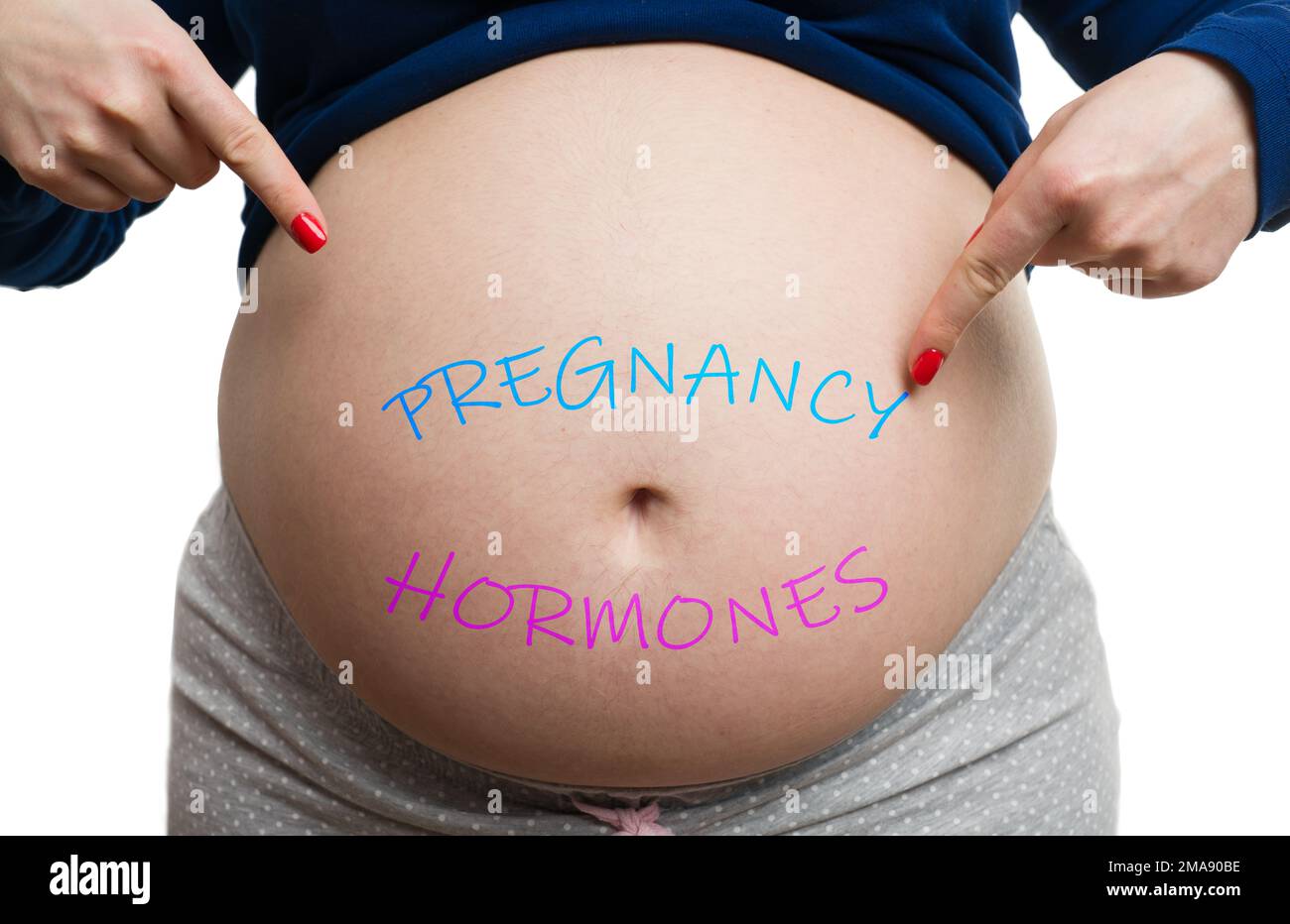Close-up of future mother showing belly with pregnancy hormones text ...