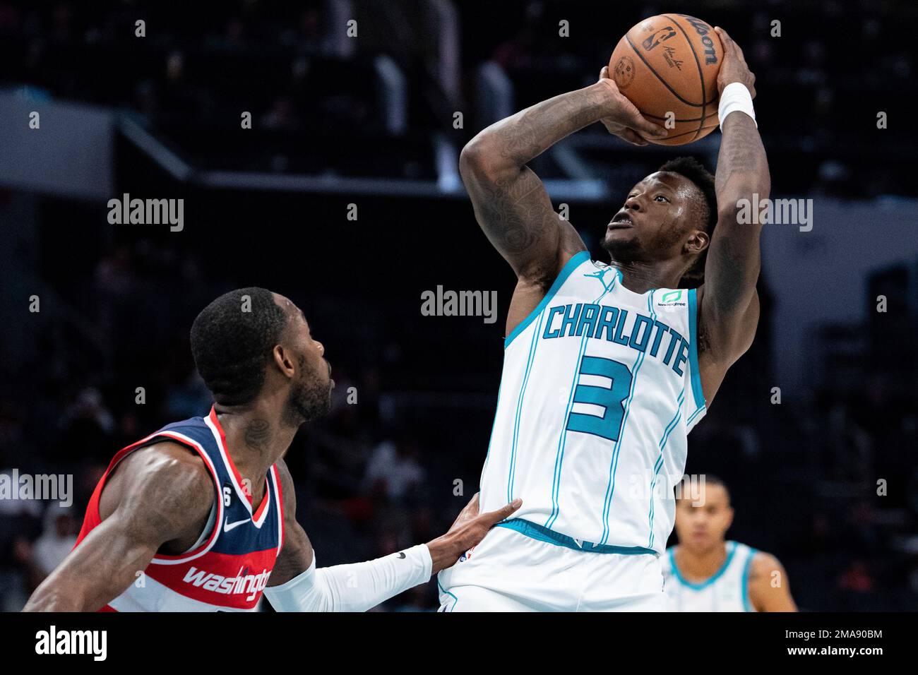 Charlotte Hornets guard Terry Rozier (3) shoots the ball over Washington Wizards forward Will ...