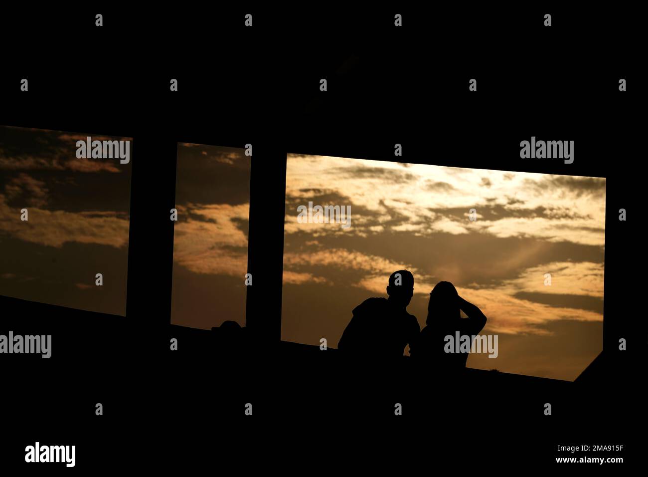 Fans watch the sunset from inside Arrowhead Stadium before the start of ...