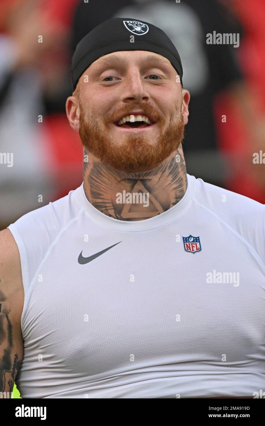 Las Vegas Raiders defensive end Maxx Crosby (98) works out before an ...