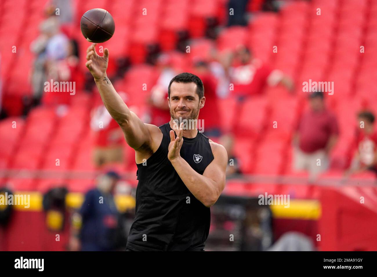 Las Vegas Raiders quarterback Derek Carr warms up before the start of ...