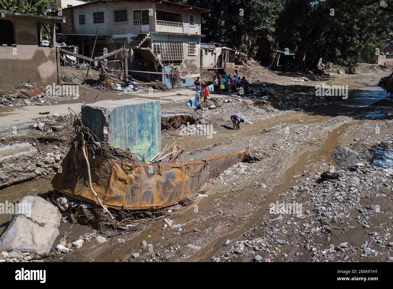 Locals begin to rocover after a landslide and flood ripped through Las ...