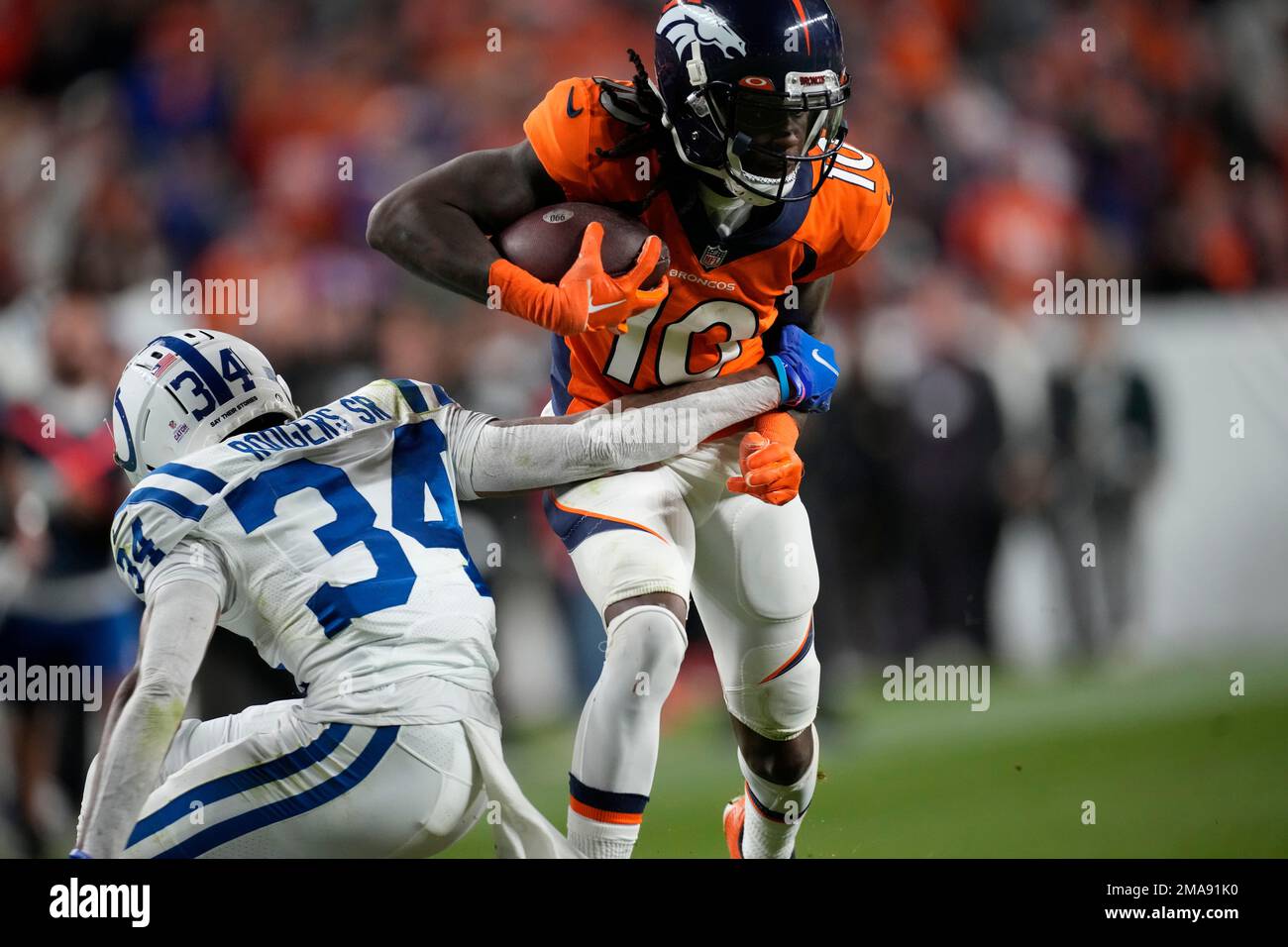 Indianapolis Colts cornerback Isaiah Rodgers (34) stops Denver Broncos ...