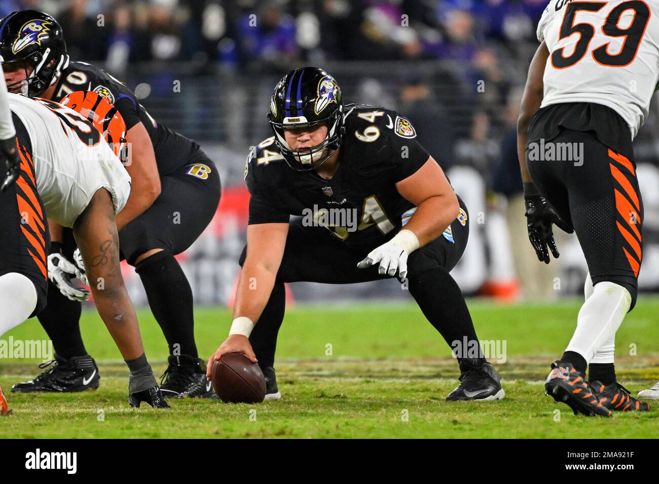 Baltimore Ravens center Tyler Linderbaum (64) gets set to hike the ball ...