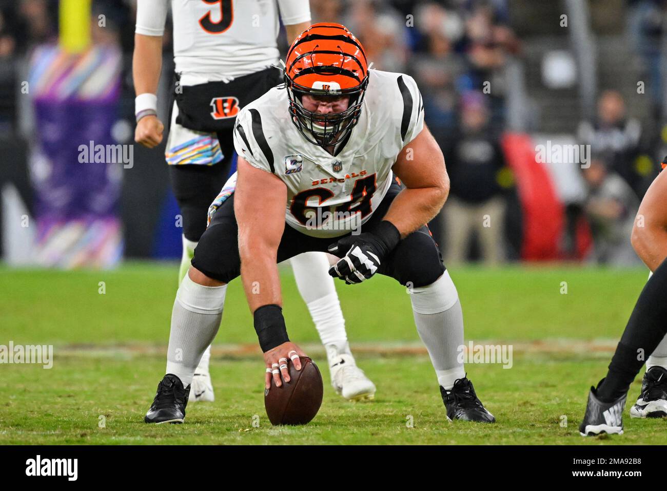 Cincinnati Bengals center Ted Karras (64) gets set to hike the ball ...