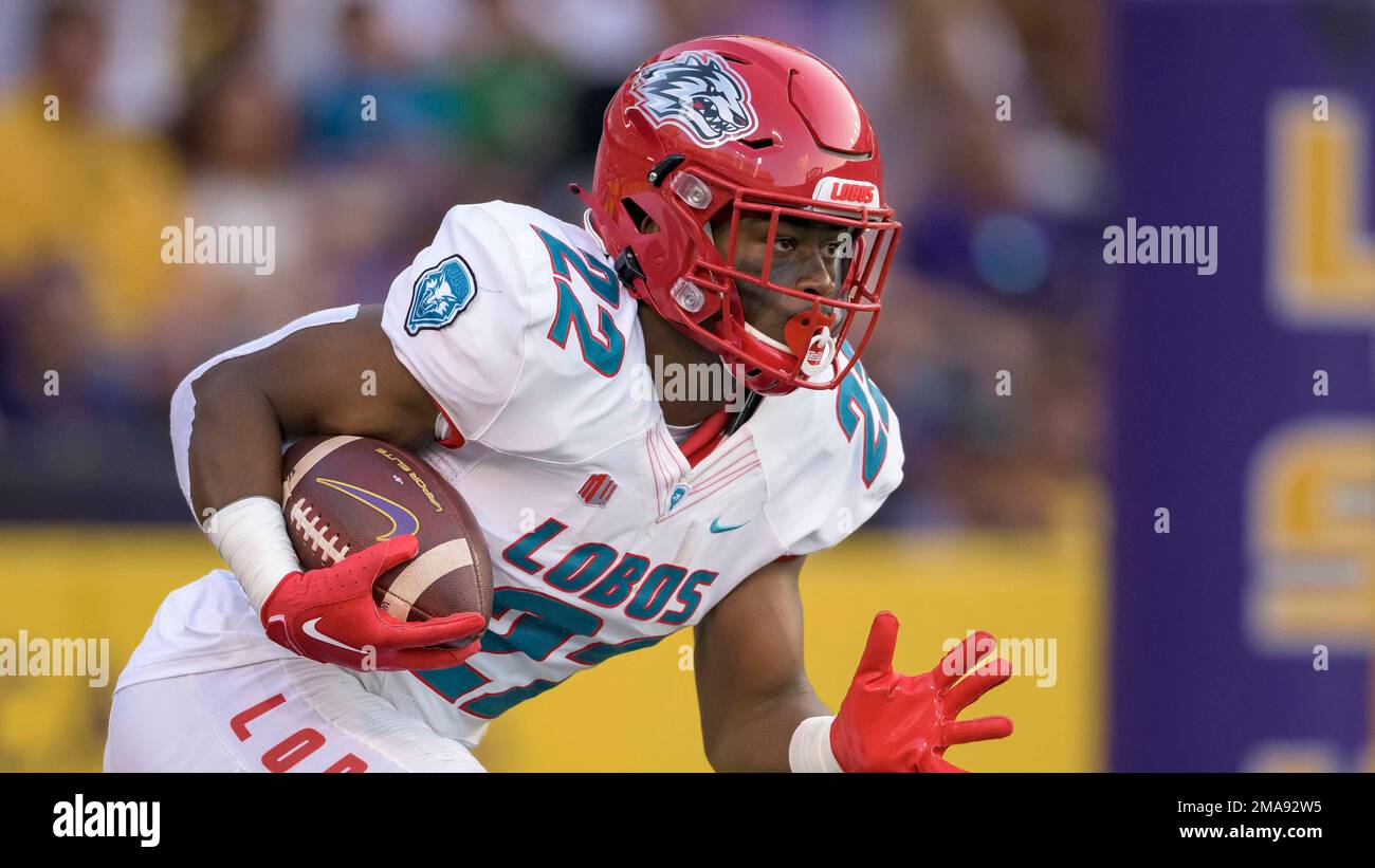 New Mexico running back Christian Washington (22) runs during the first ...