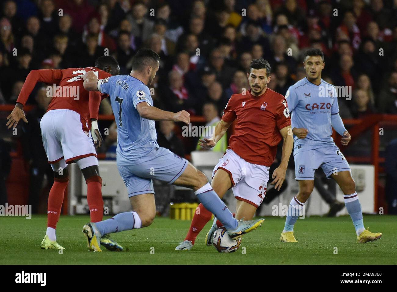 Aston Villa's John McGinn, 2nd left, tackles Nottingham Forest's Remo ...