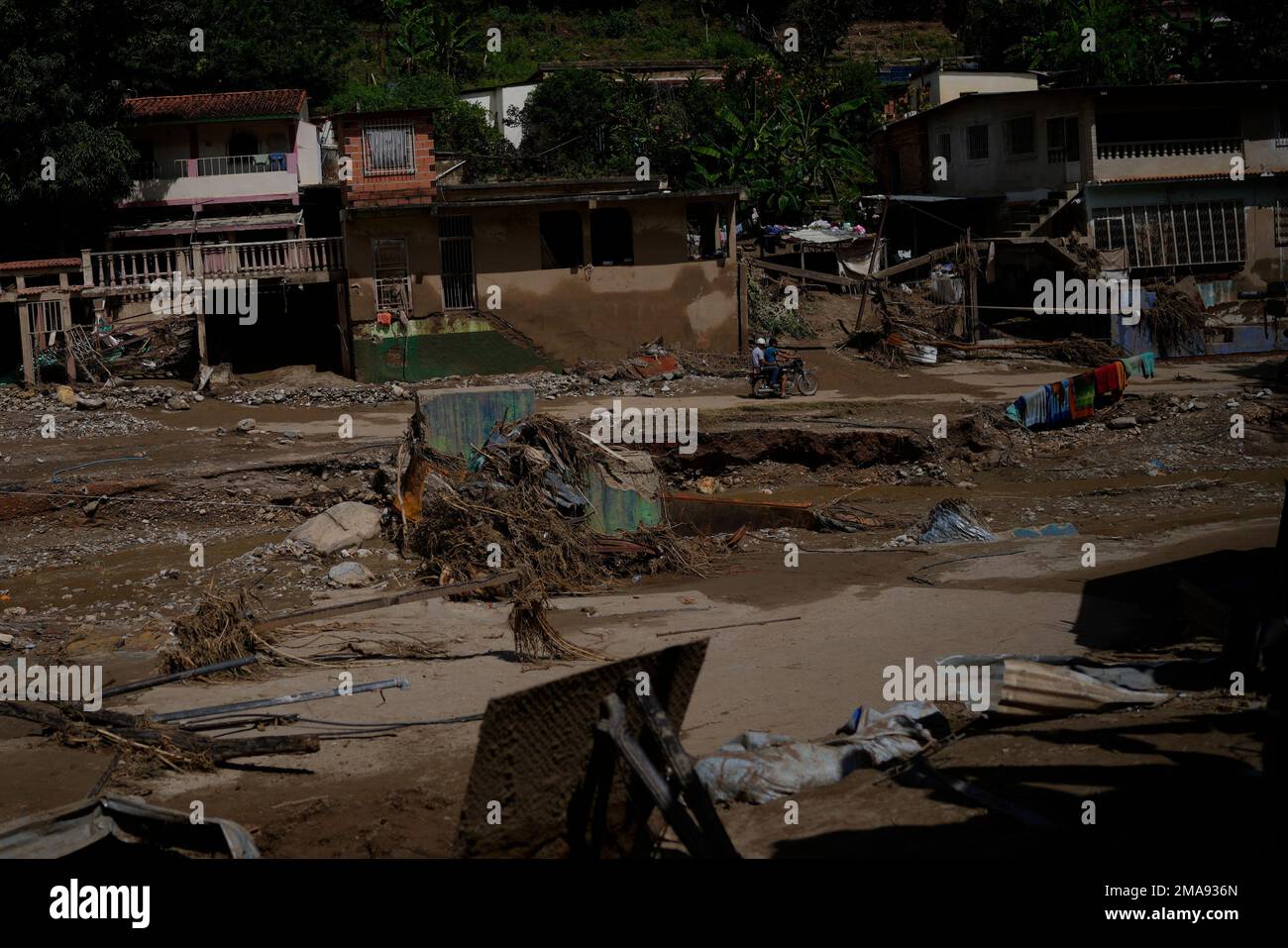 Residents survey the damage after deadly flooding in Las Tejerias ...