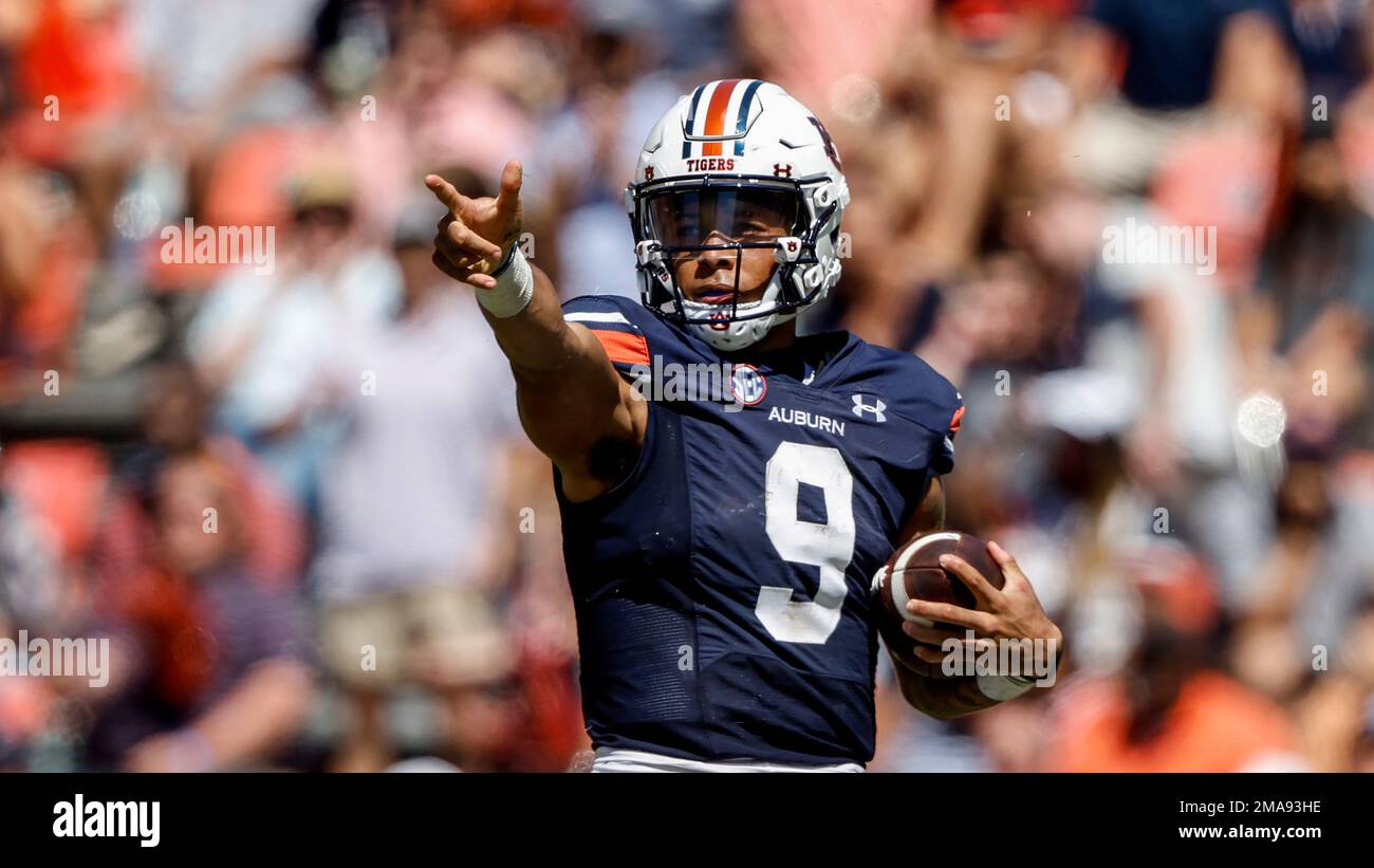 Auburn quarterback Robby Ashford reacts after making a first down ...
