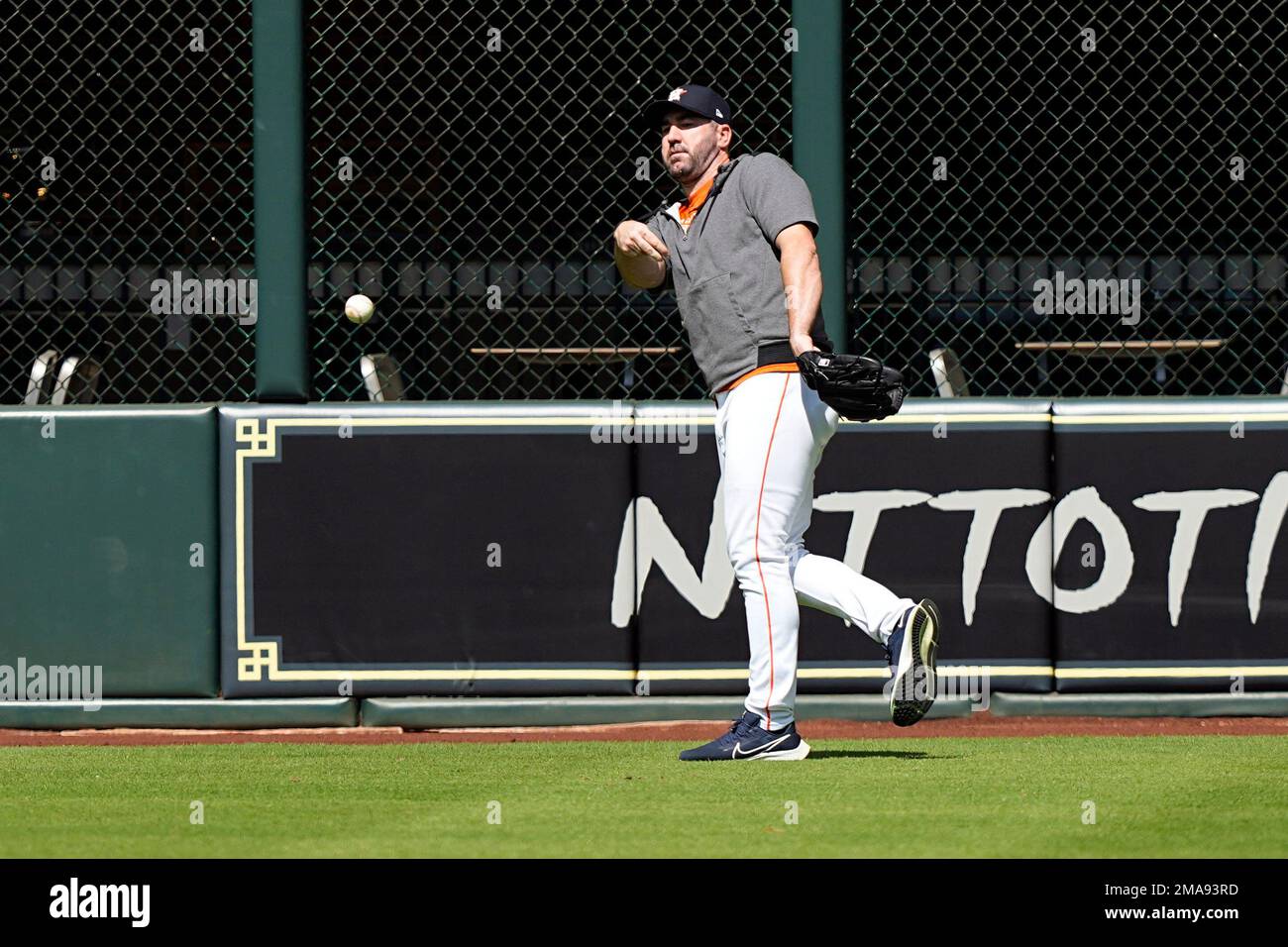 Houston Astros starting pitcher Justin Verlander tosses a ball during a ...