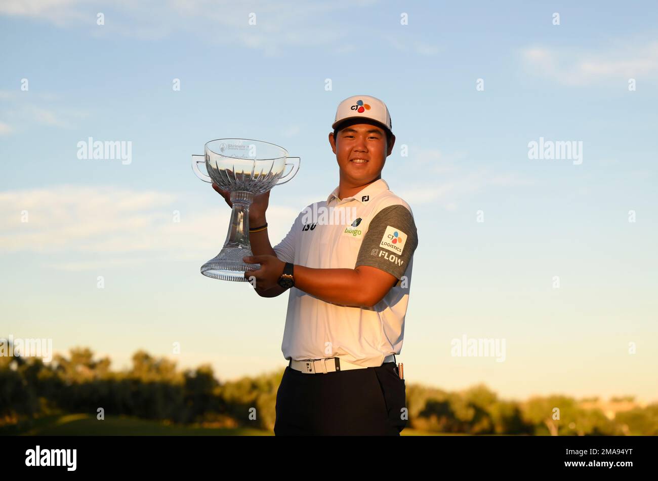 Tom Kim, of South Korea, displays the trophy after winning the Shriners ...